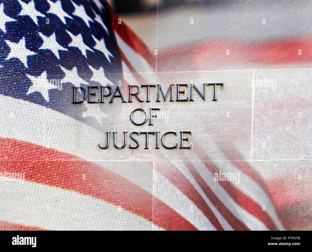 Department of Justice building sign with an American Flag behind it ...