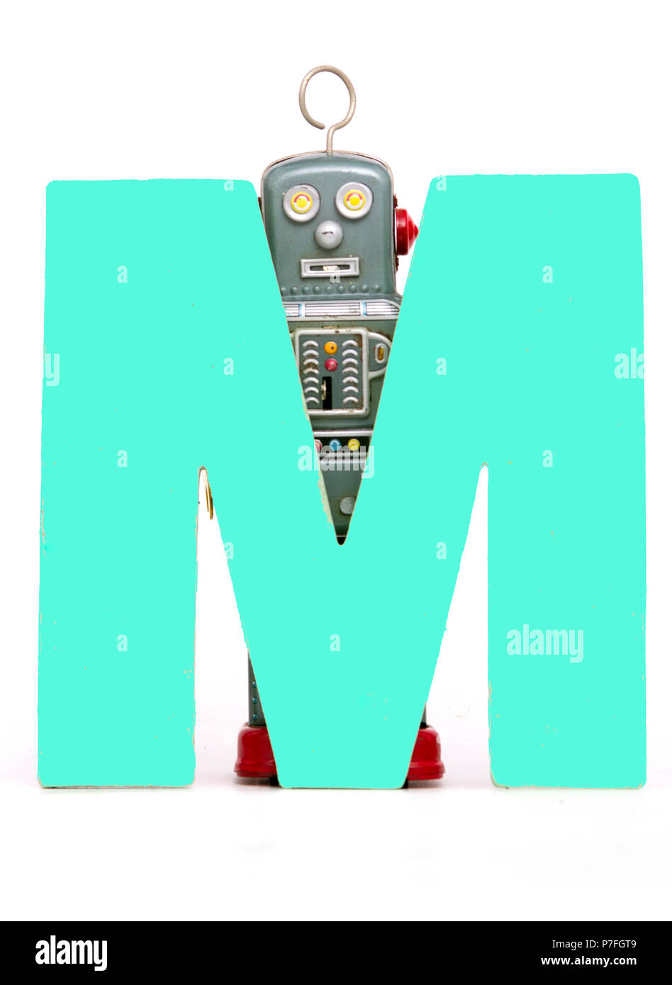 capital letter M held by vintage robot toys Stock Photo - Alamy