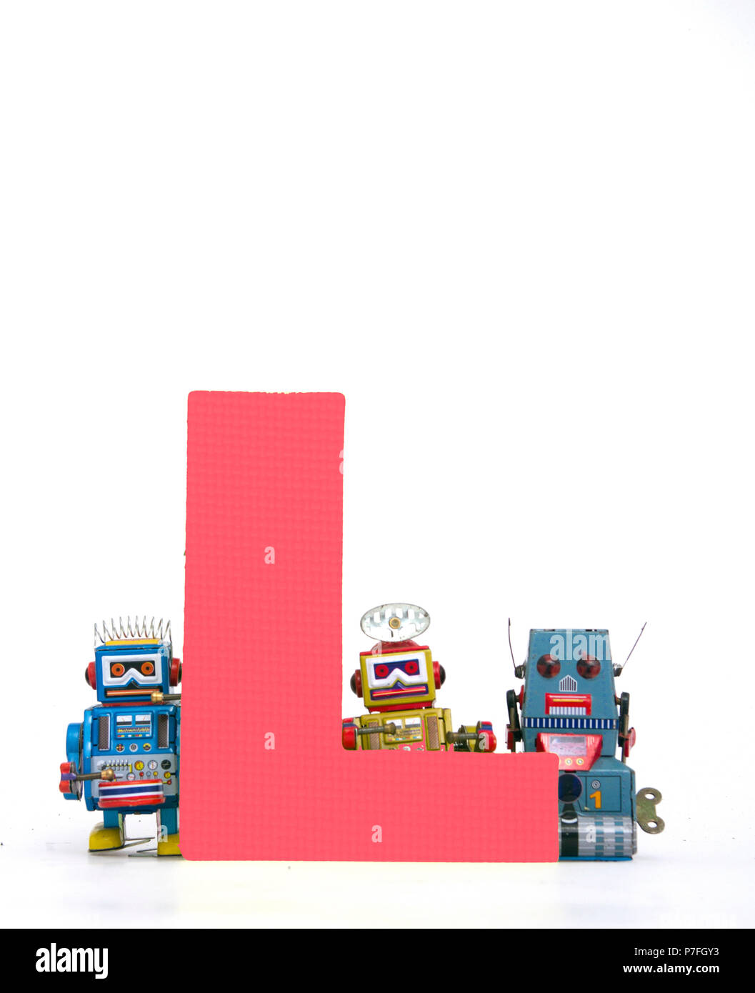 capital letter L held by vintage robot toys Stock Photo - Alamy
