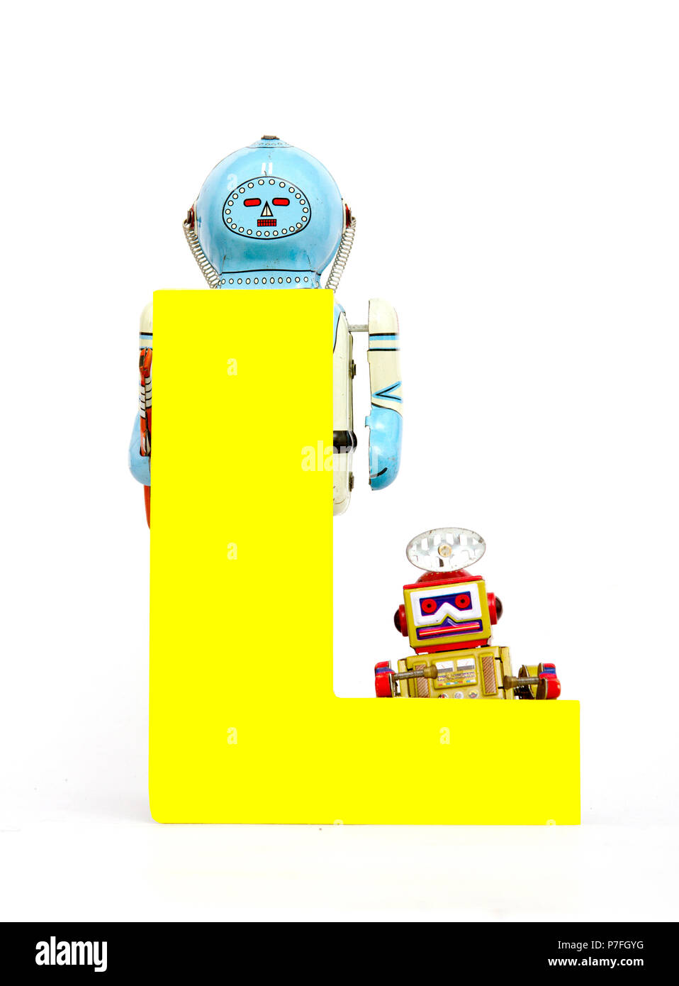 capital letter L held by vintage robot toys Stock Photo - Alamy