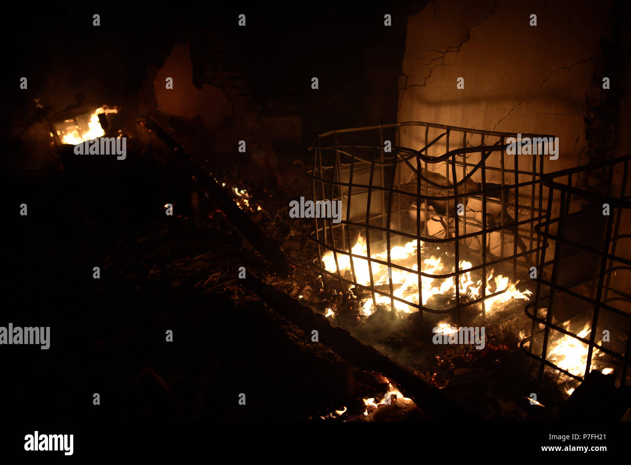Silhouette of fireman fighting bushfire at night Stock Photo - Alamy