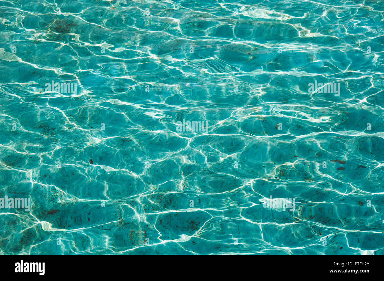 Blue abstract background. The dirty water in the blue pool in the ...