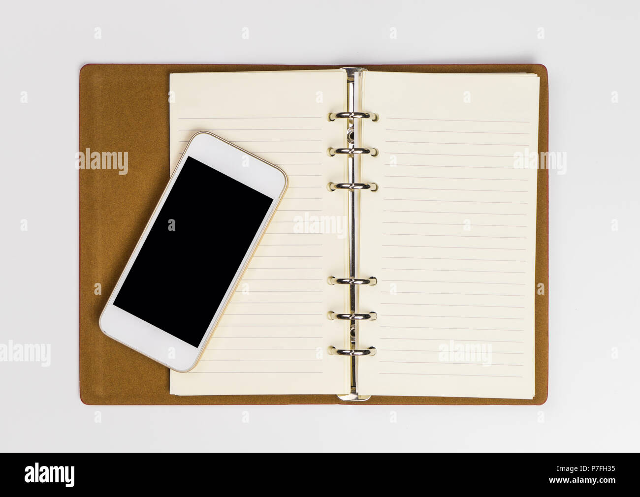 Blank Smartphone on an open notebook page for diary organizer concept ...