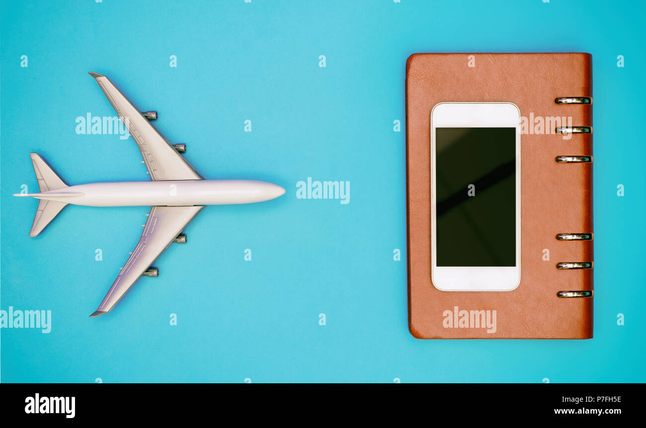 Plane for travel concept with Blank phone screen and notebook Stock ...