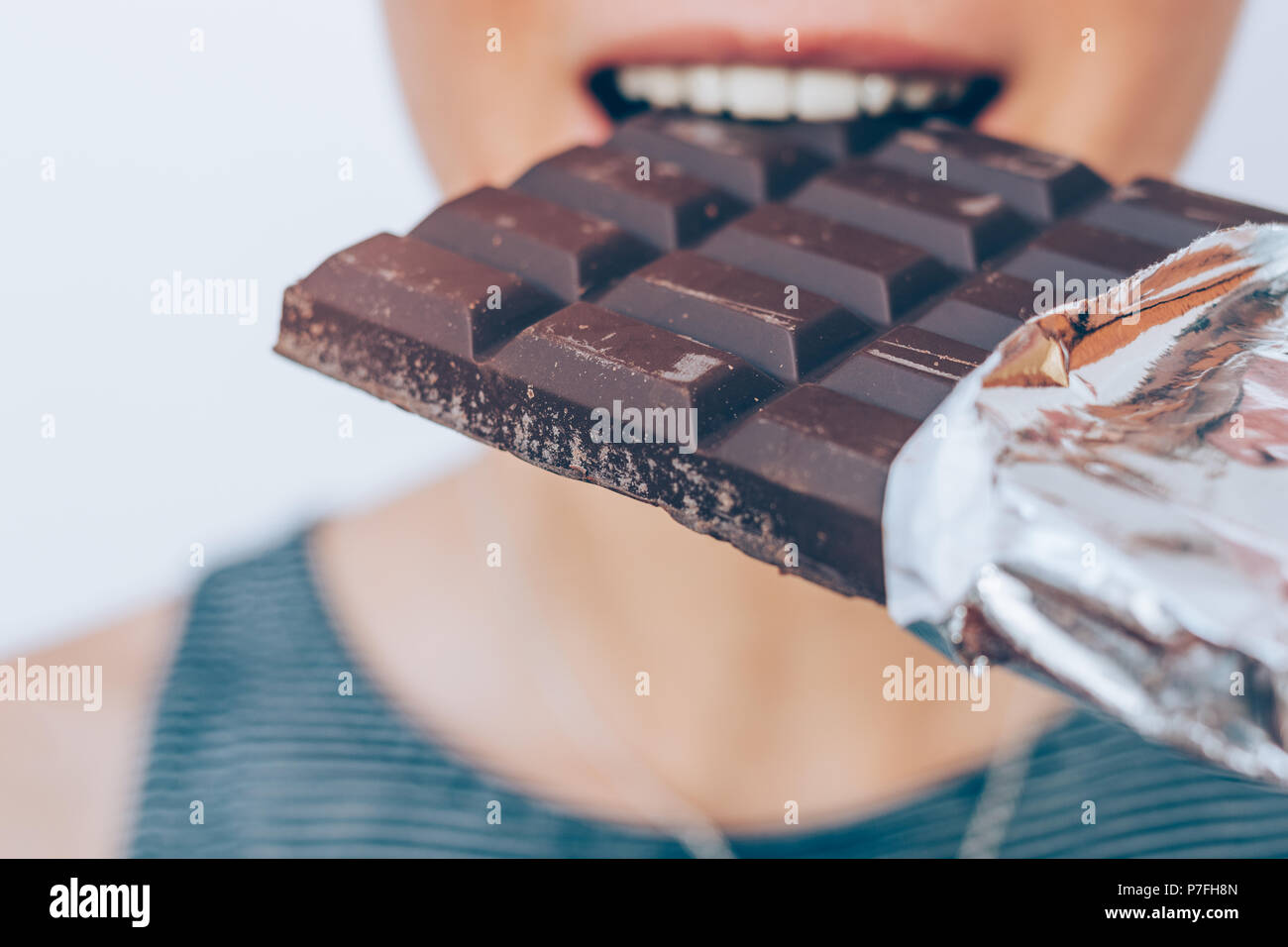 Black woman eating chocolate bar hi-res stock photography and images ...