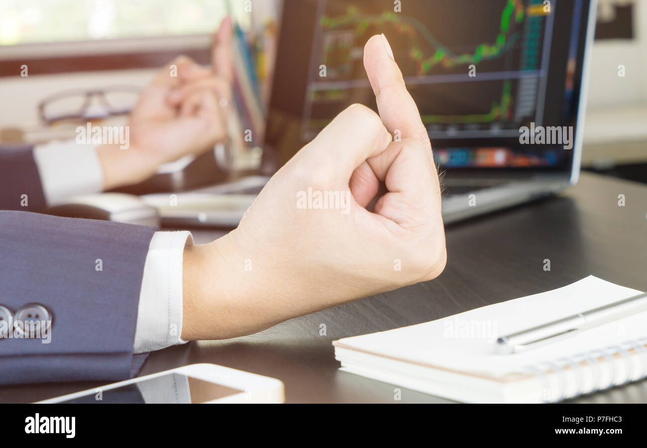 Stock trader showing middle finger to the Stock screen Stock Photo - Alamy