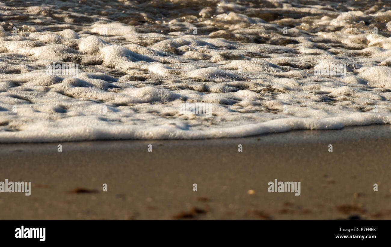 Little wave in close up Stock Photo - Alamy