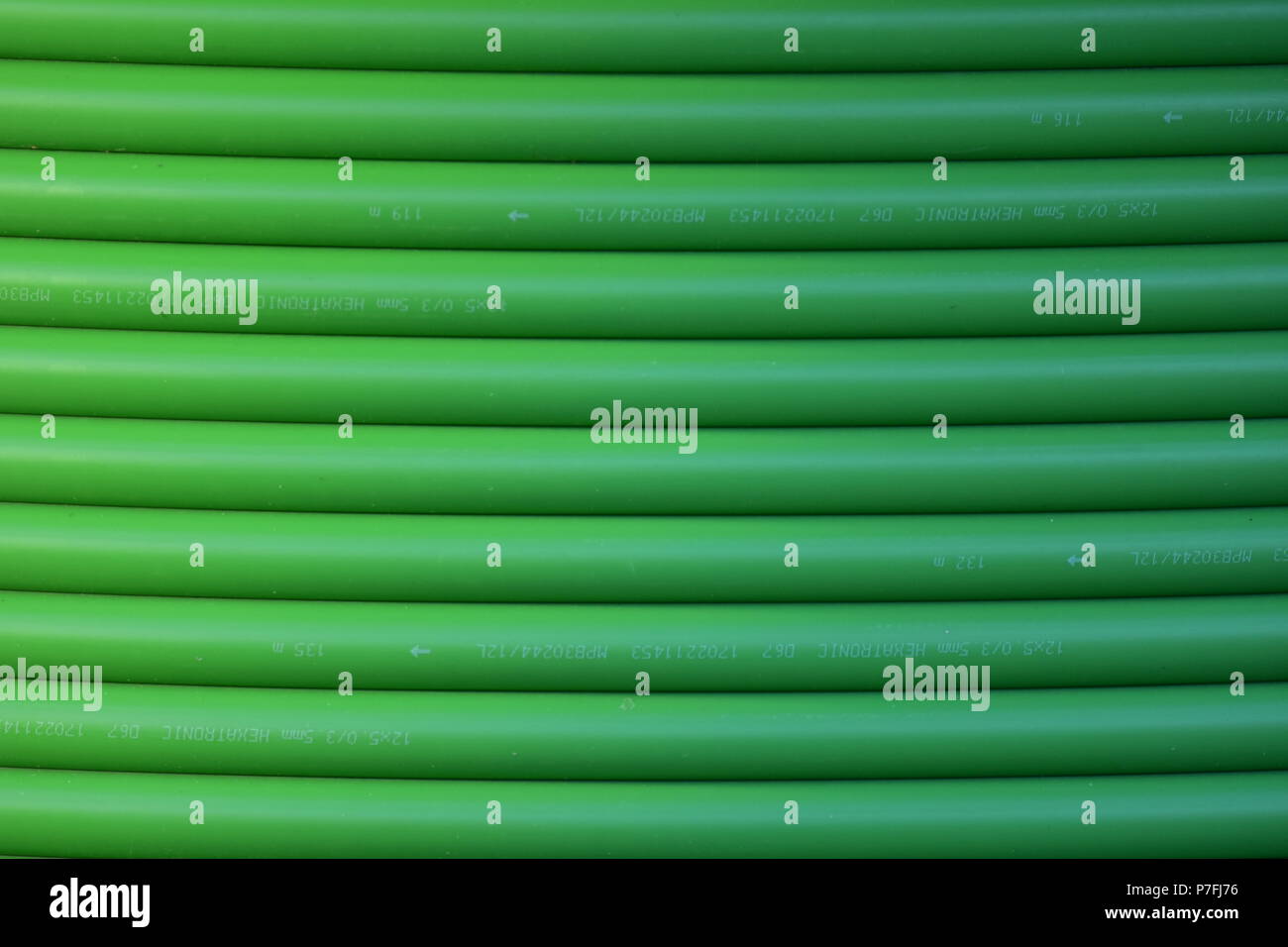 Green outer shell of thick optical cable forming bars pattern Stock ...