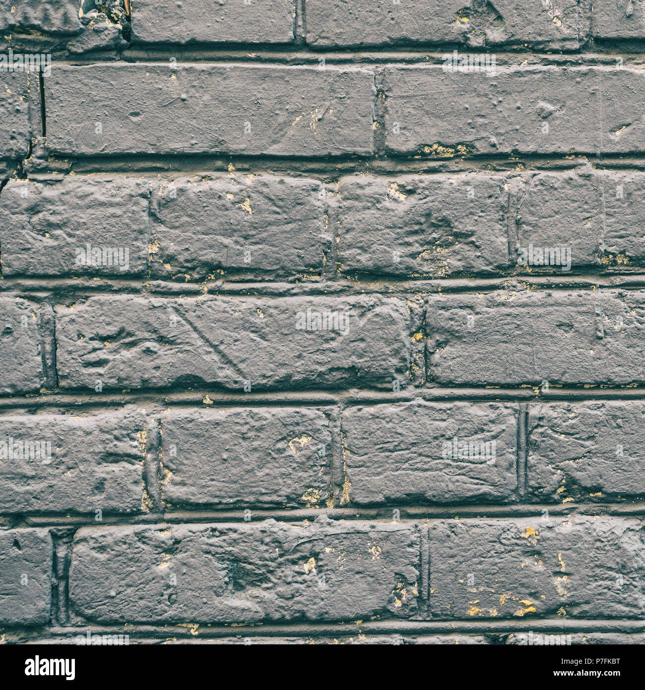 Old grey brick wall for background and design Stock Photo - Alamy