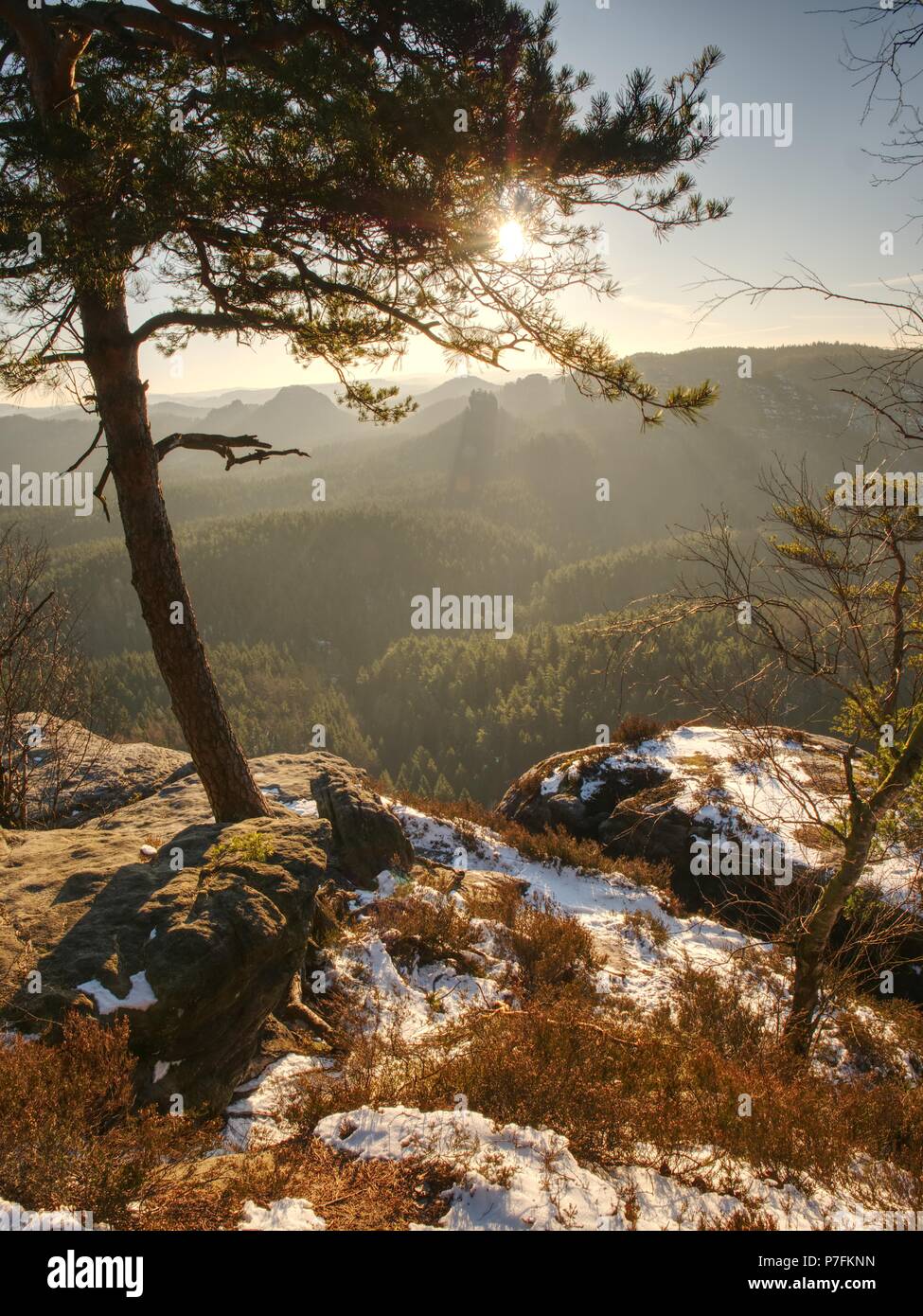 Chilly autumnal foggy weather bellow peak. Exposed sandstone rocks with ...