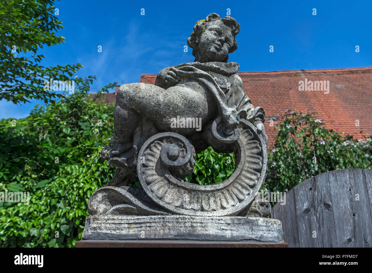 Baroque putto figure on a pedestal, Nördlingen, Bavaria, Germany Stock ...