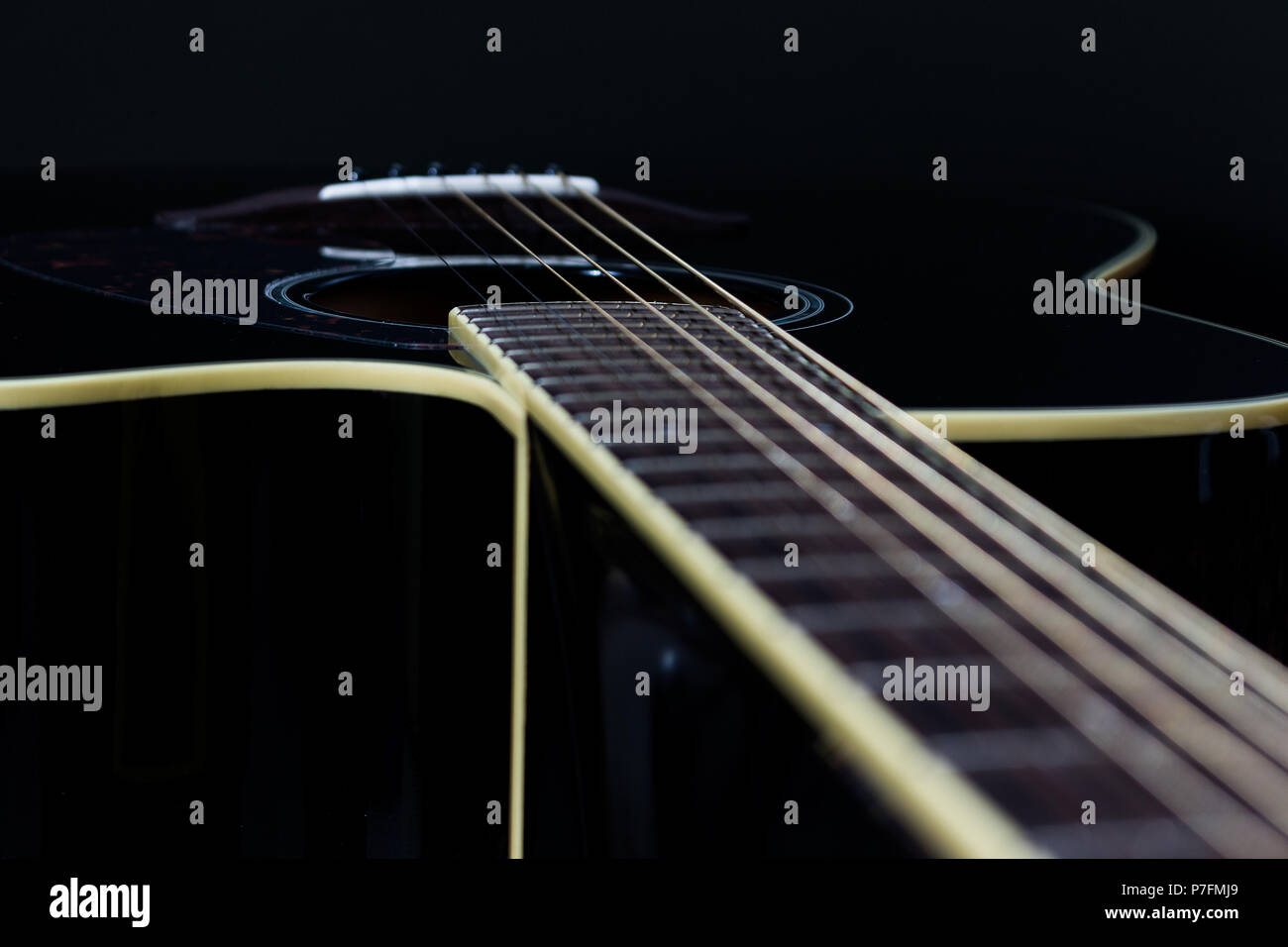acoustic guitar on dark backdrop Stock Photo - Alamy
