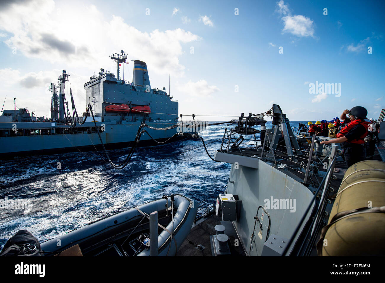 The guided-missile destroyer USS Dewey (DDG 105) conducts a ...