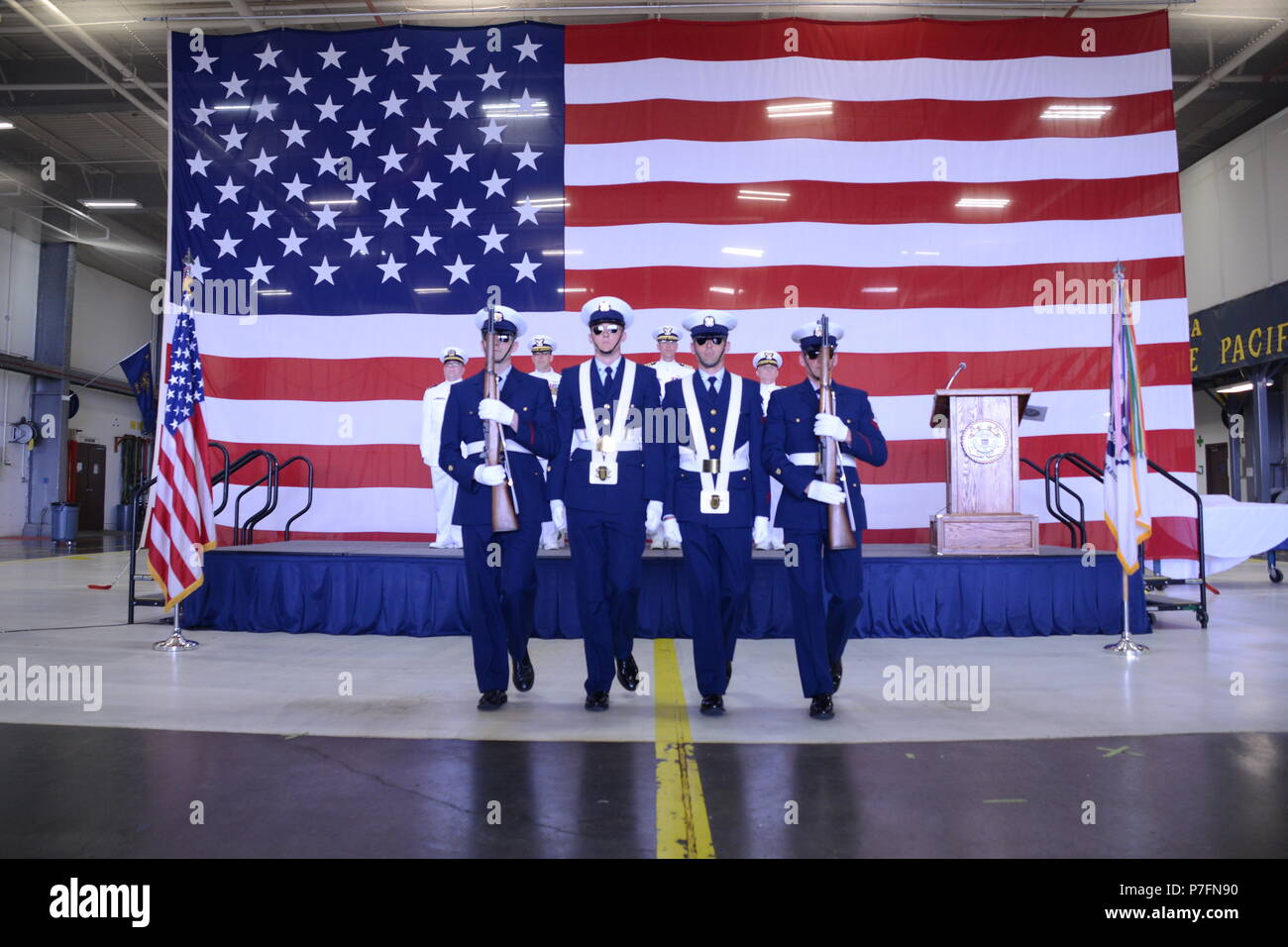 A Sector Columbia River color guard marches down an aisle after posting ...