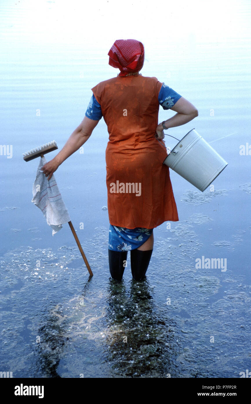 Cleaning lady at sea, Berlin, Germany Stock Photo - Alamy