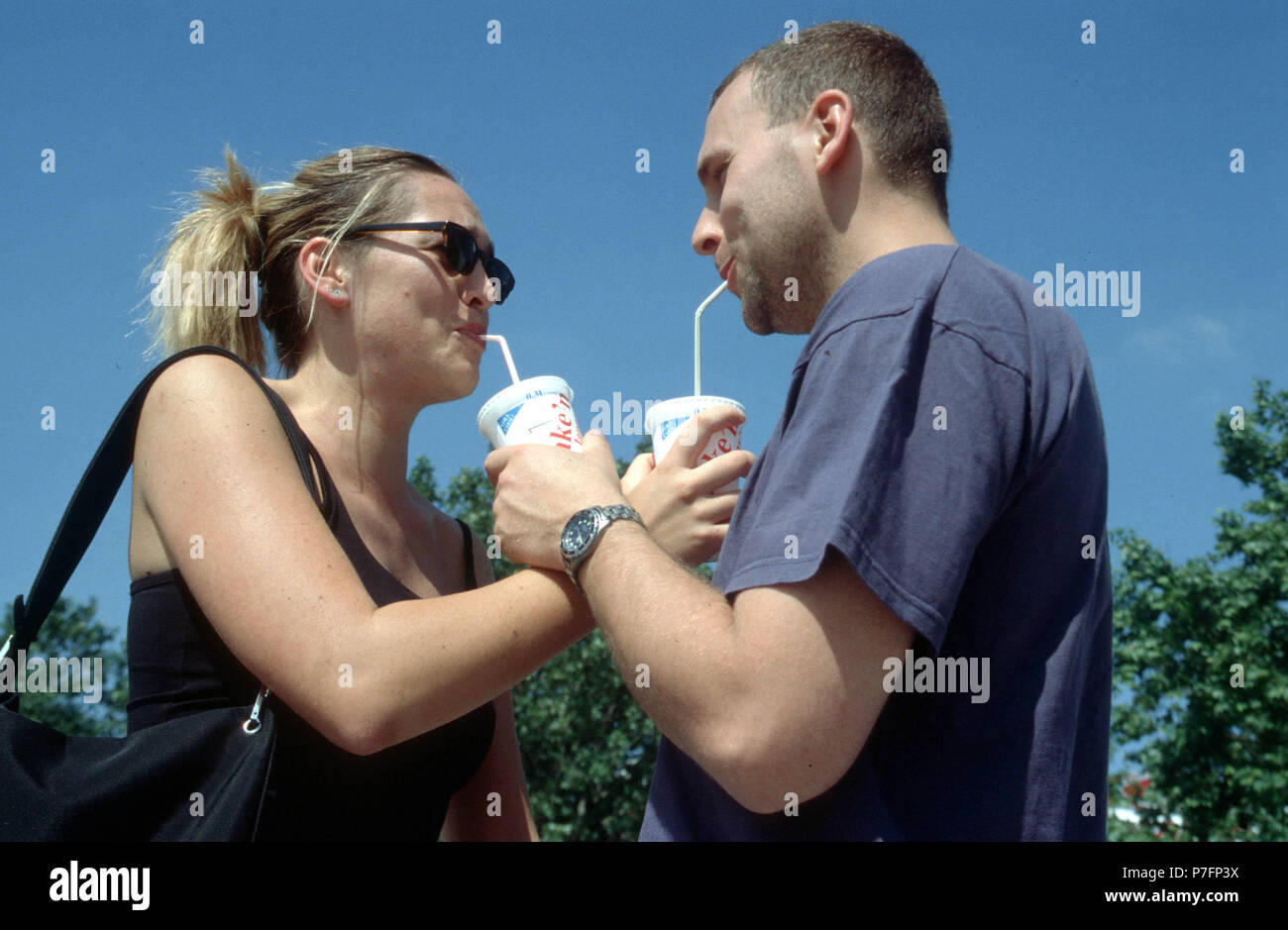 Sharing drinks hi-res stock photography and images - Alamy