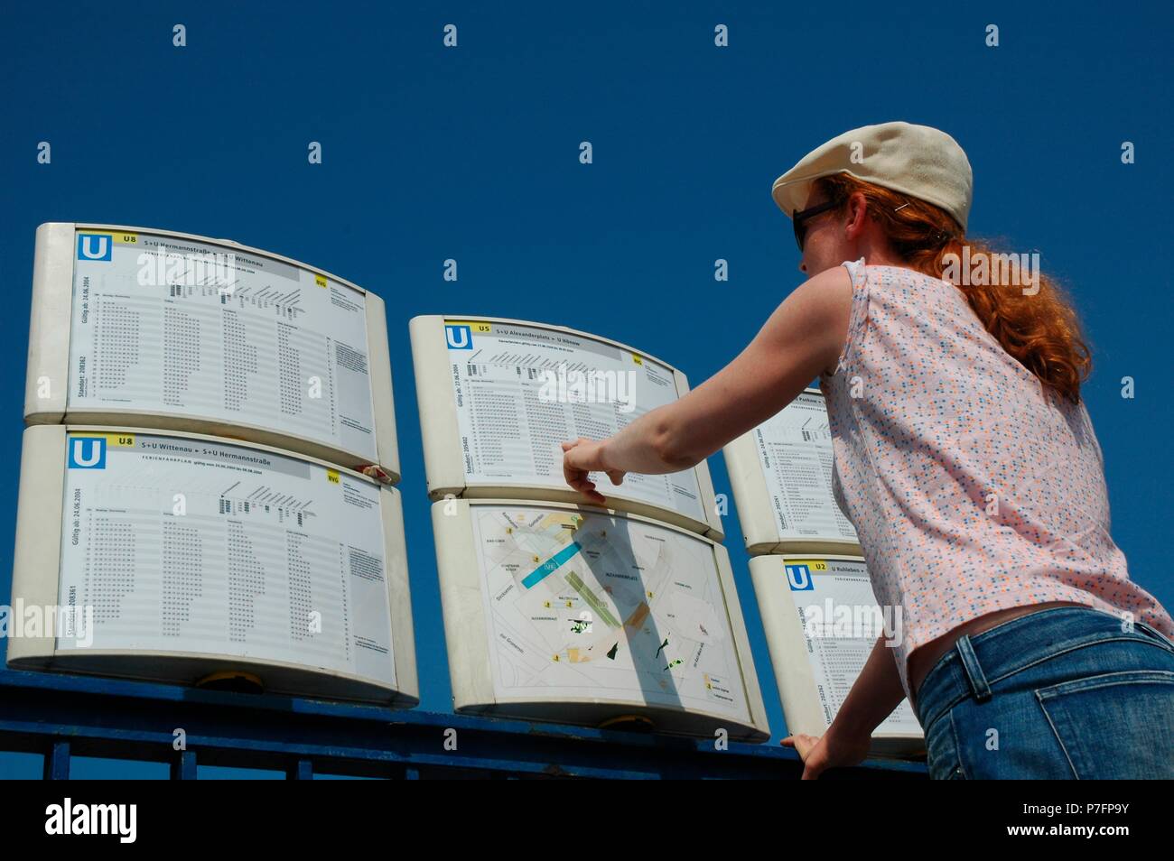 Orientation, woman with timetable metro, Germany Stock Photo - Alamy