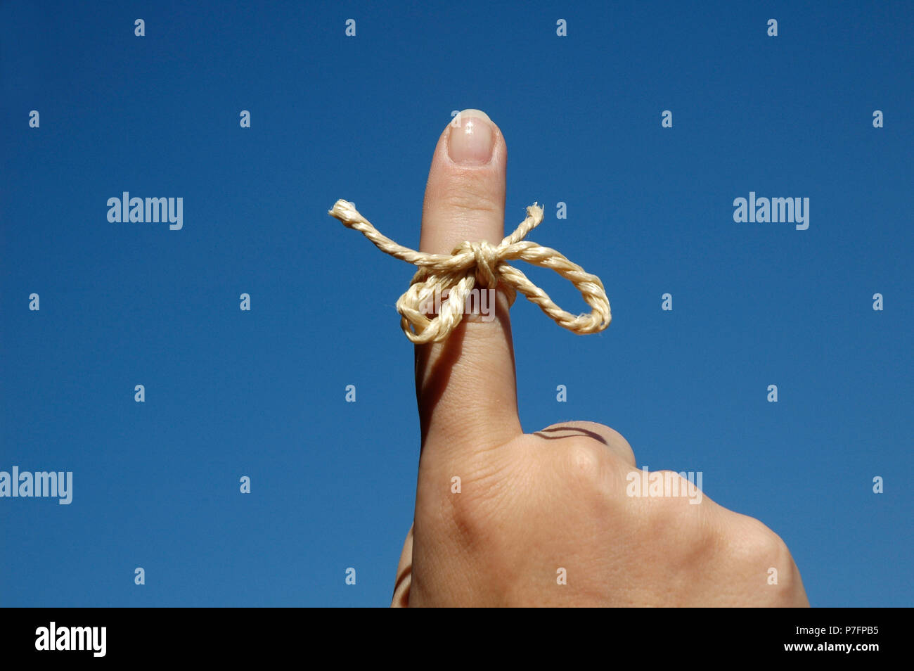 String around finger hi-res stock photography and images - Alamy