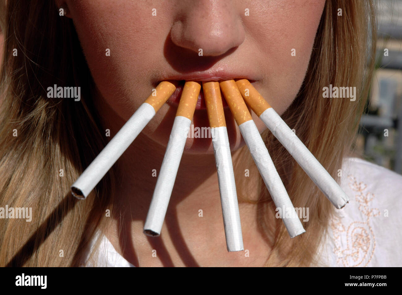 Addiction, Woman smokes many cigarettes, Germany Stock Photo - Alamy