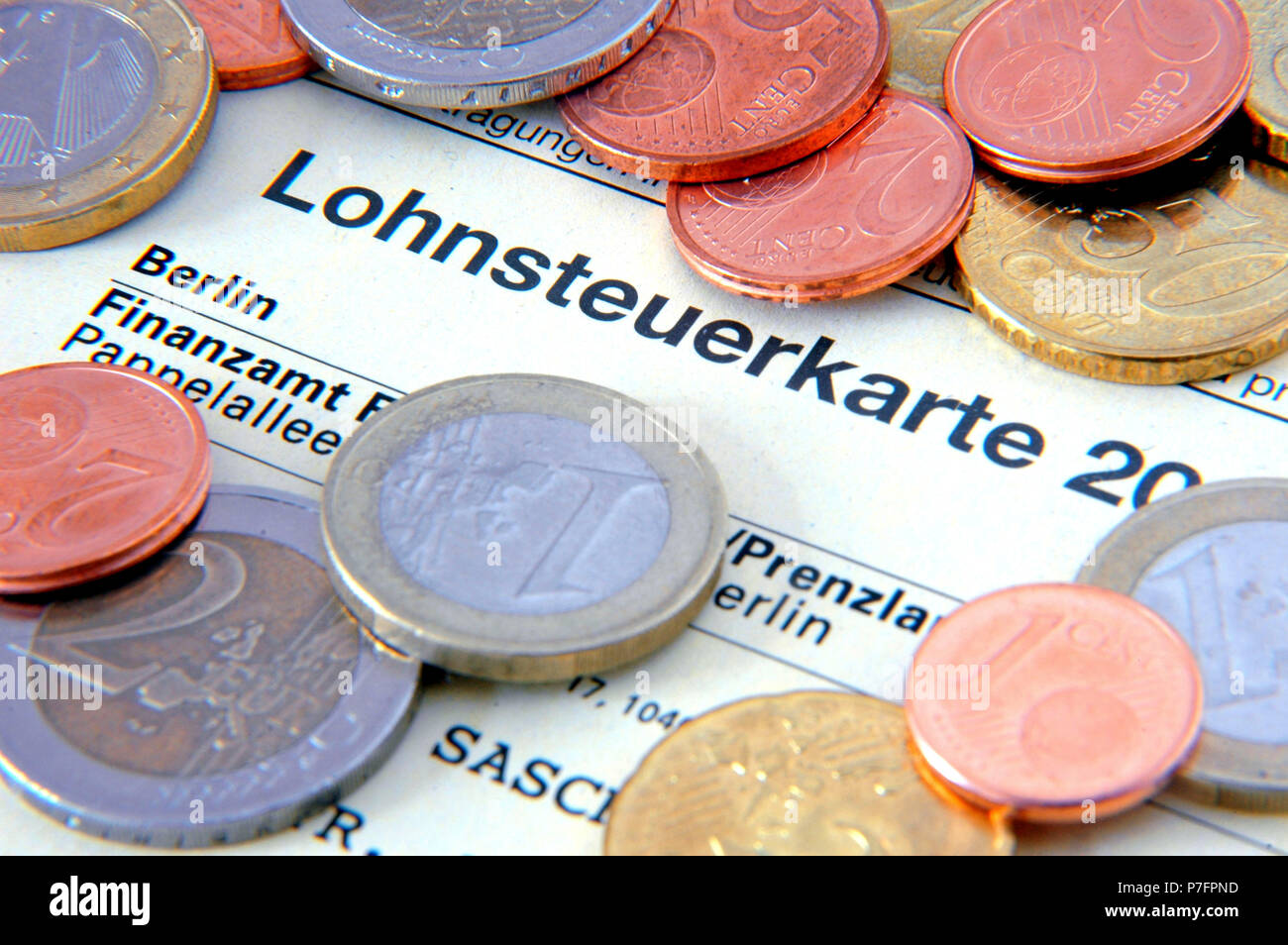 Wage tax card with coins, symbol picture for income tax and treasury ...