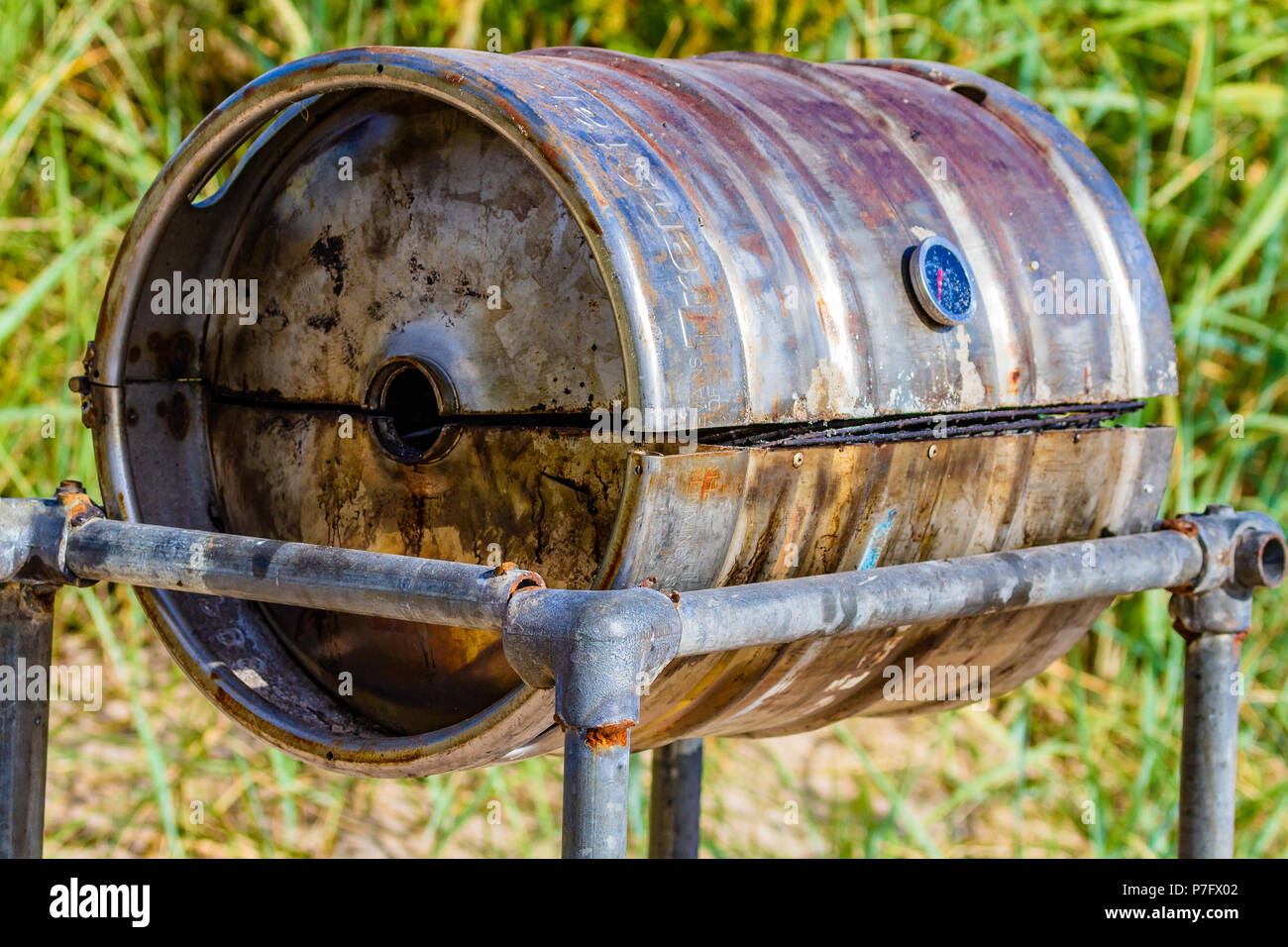 Northumberland, UK. 6th July, 2018. A barbeque made from an old beer ...