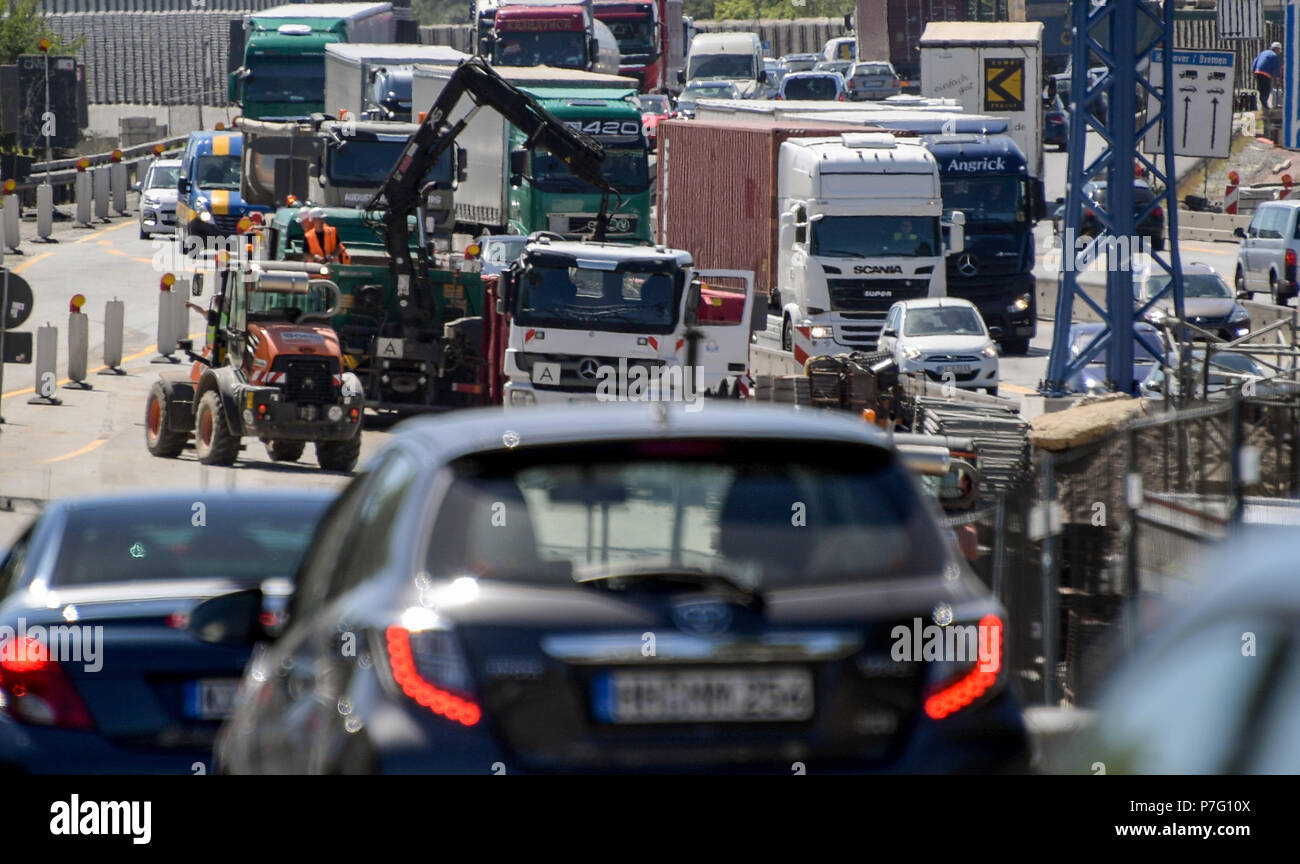 06 July 2018, Germany, Hamburg: Cars forming a traffic jam by a ...