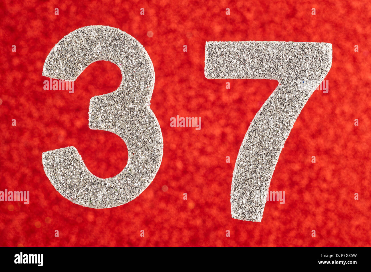 Number thirty-seven silver color over a red background. Anniversary ...