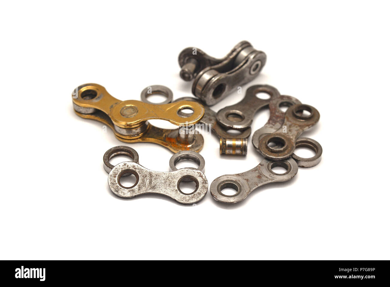 disassembled bicycle chain in rivets and links isolated on white ...