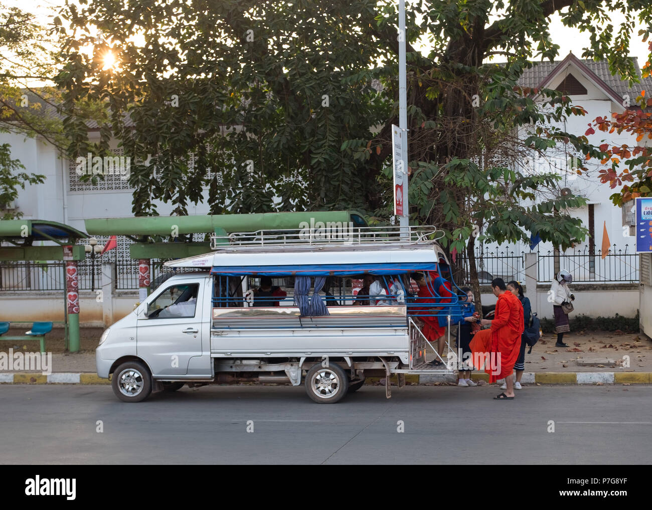 Passengers boarding into mini bus, Vientiane, Laos, Asia Stock Photo ...