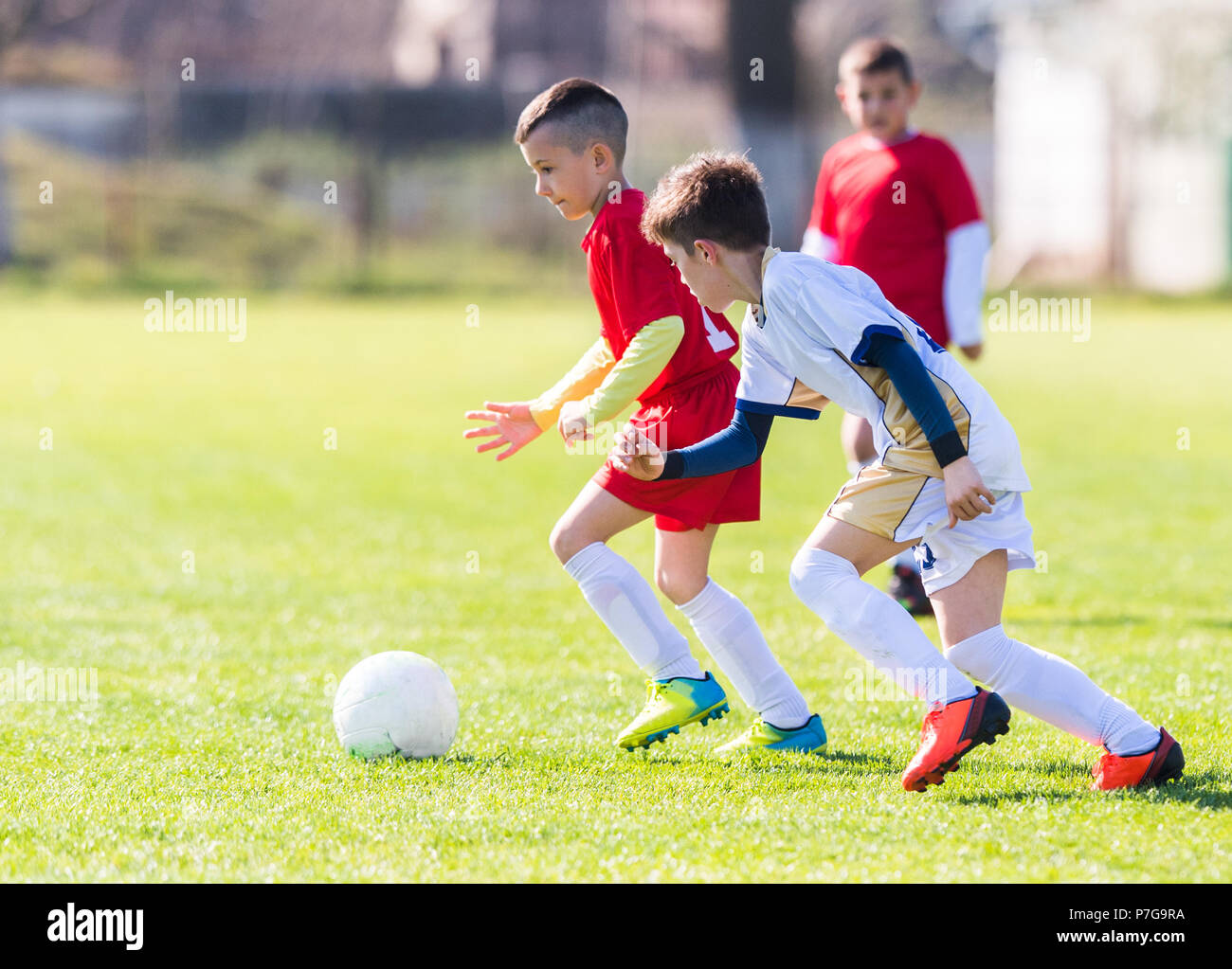 Kids soccer football - young children players match on soccer field ...