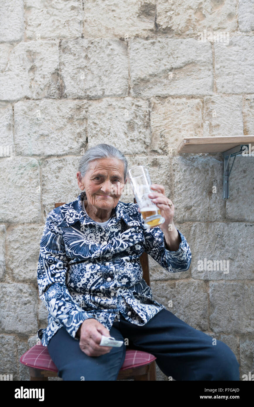 Old lady drinking beer, Split, Croatia Stock Photo - Alamy