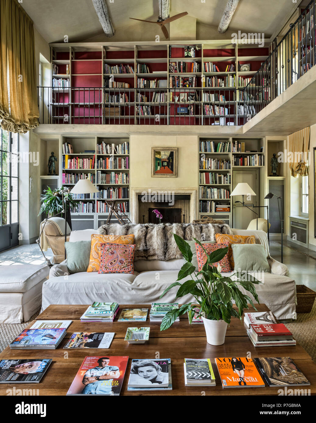 Modernised double height mezzanine library in 18th century chateaux, St ...