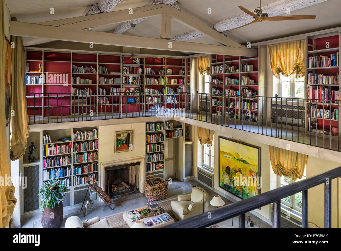 Modernised double height mezzanine library in 18th century chateaux, St ...