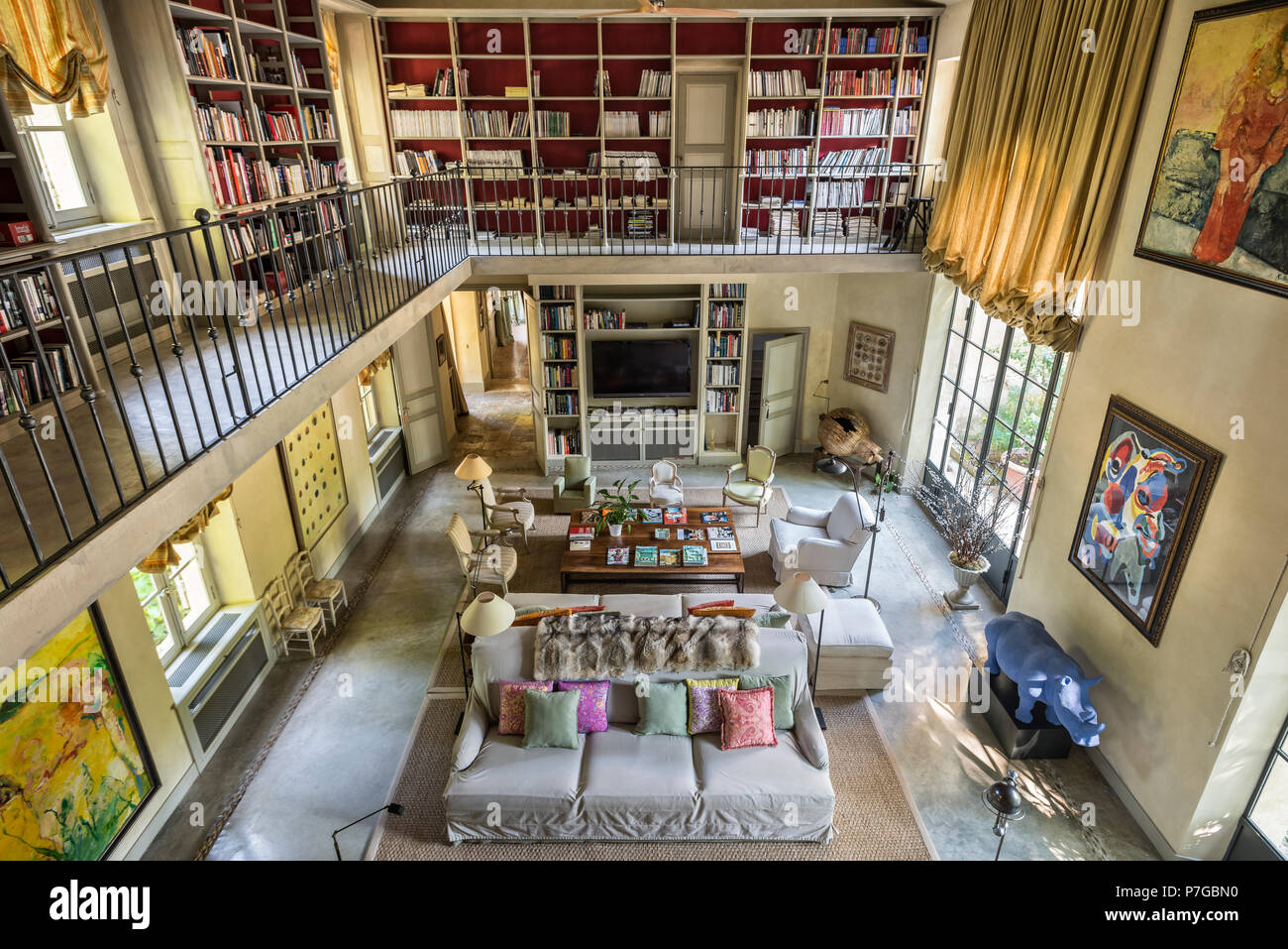 Modernised double height mezzanine library in 18th century chateaux, St ...