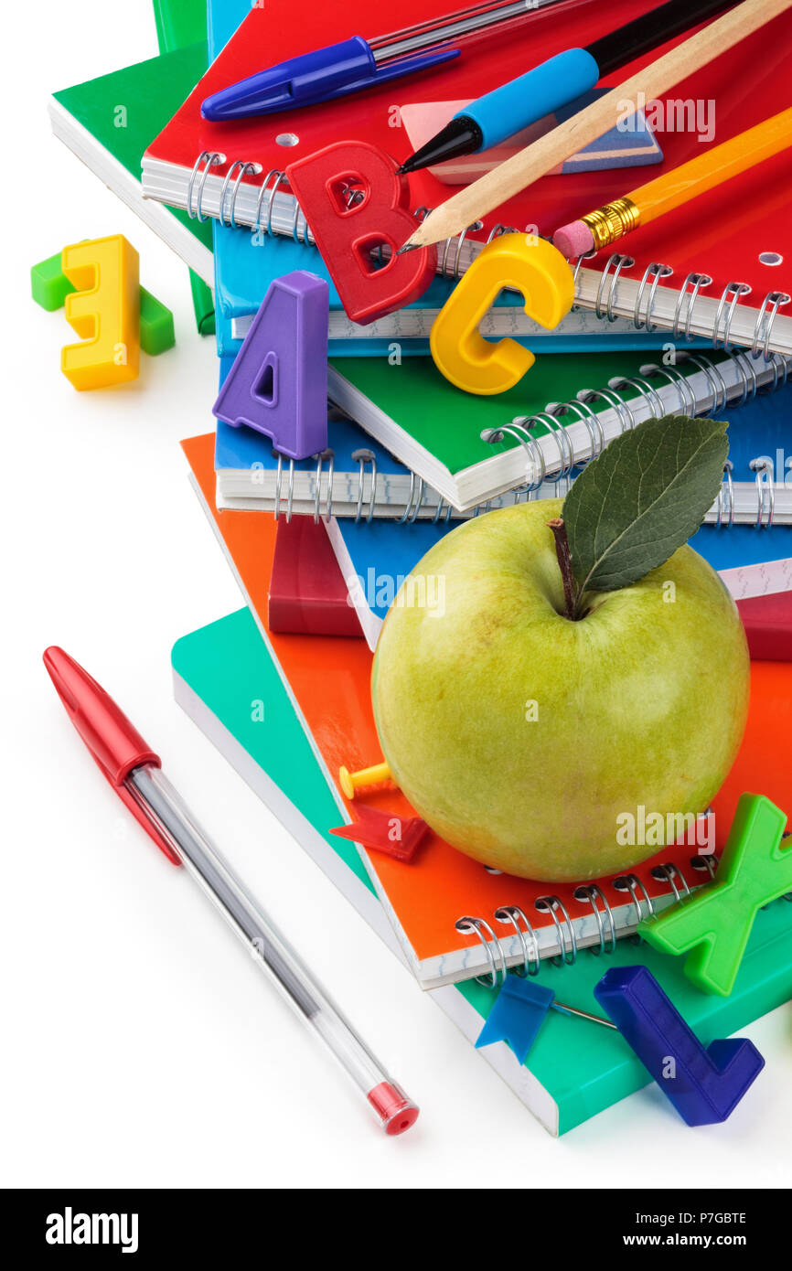 School supplies and green apple isolated on white background Stock ...