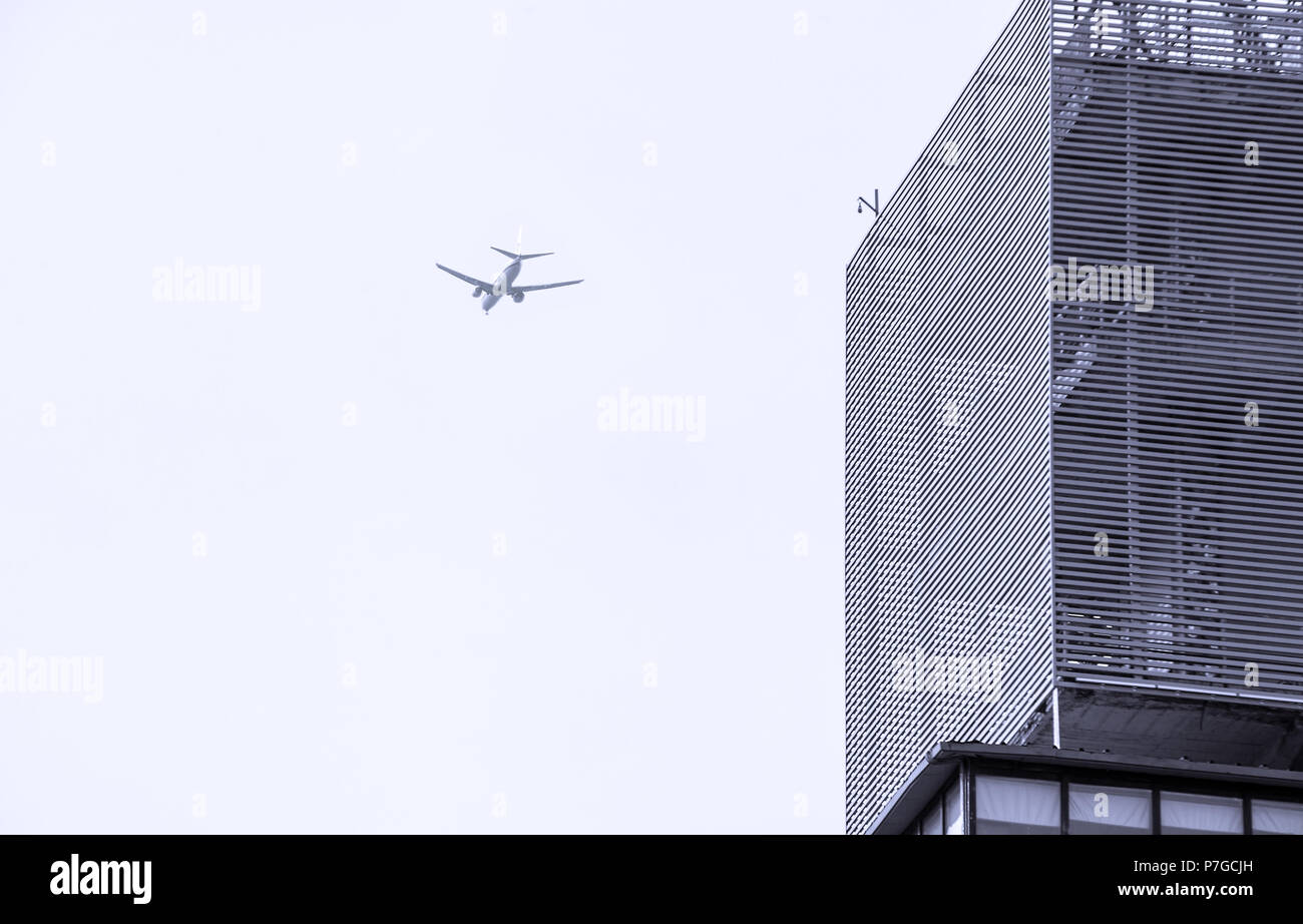 Passenger Airplane flying under the sky Stock Photo - Alamy