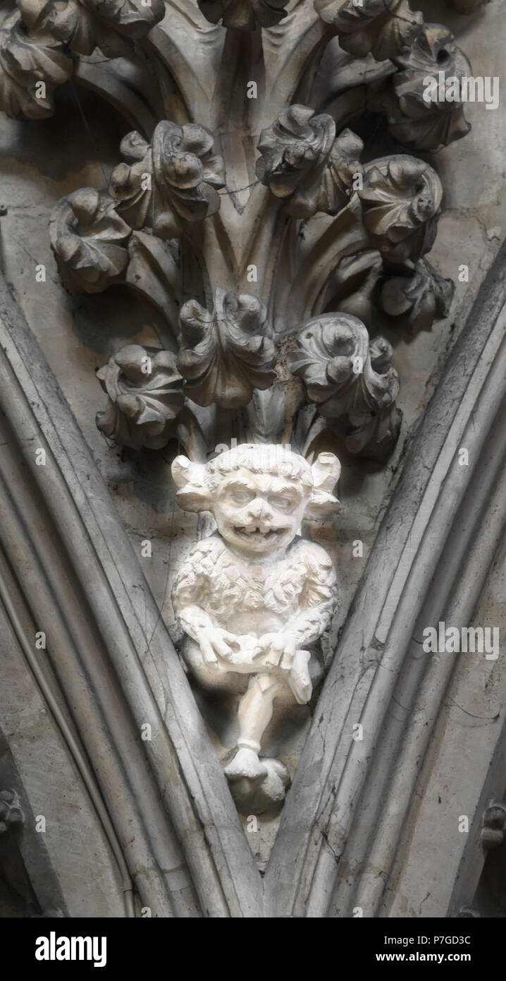 The iconic stone imp carved in a niche where two pillars join at the ...
