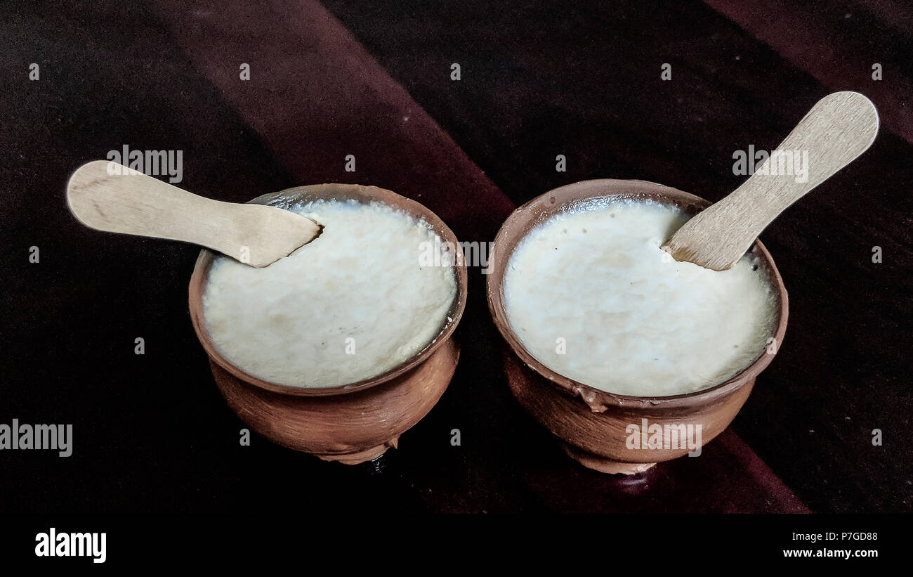 Sweet curd or sweet dahi in hindi, served in earthen pot, selective ...