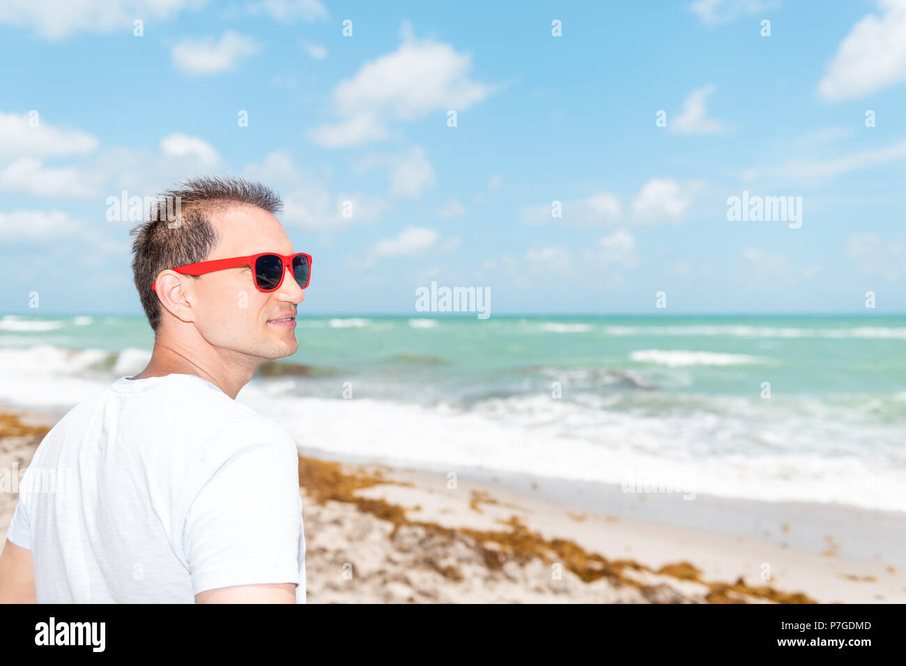 Young men sunbathing beach hi-res stock photography and images - Alamy