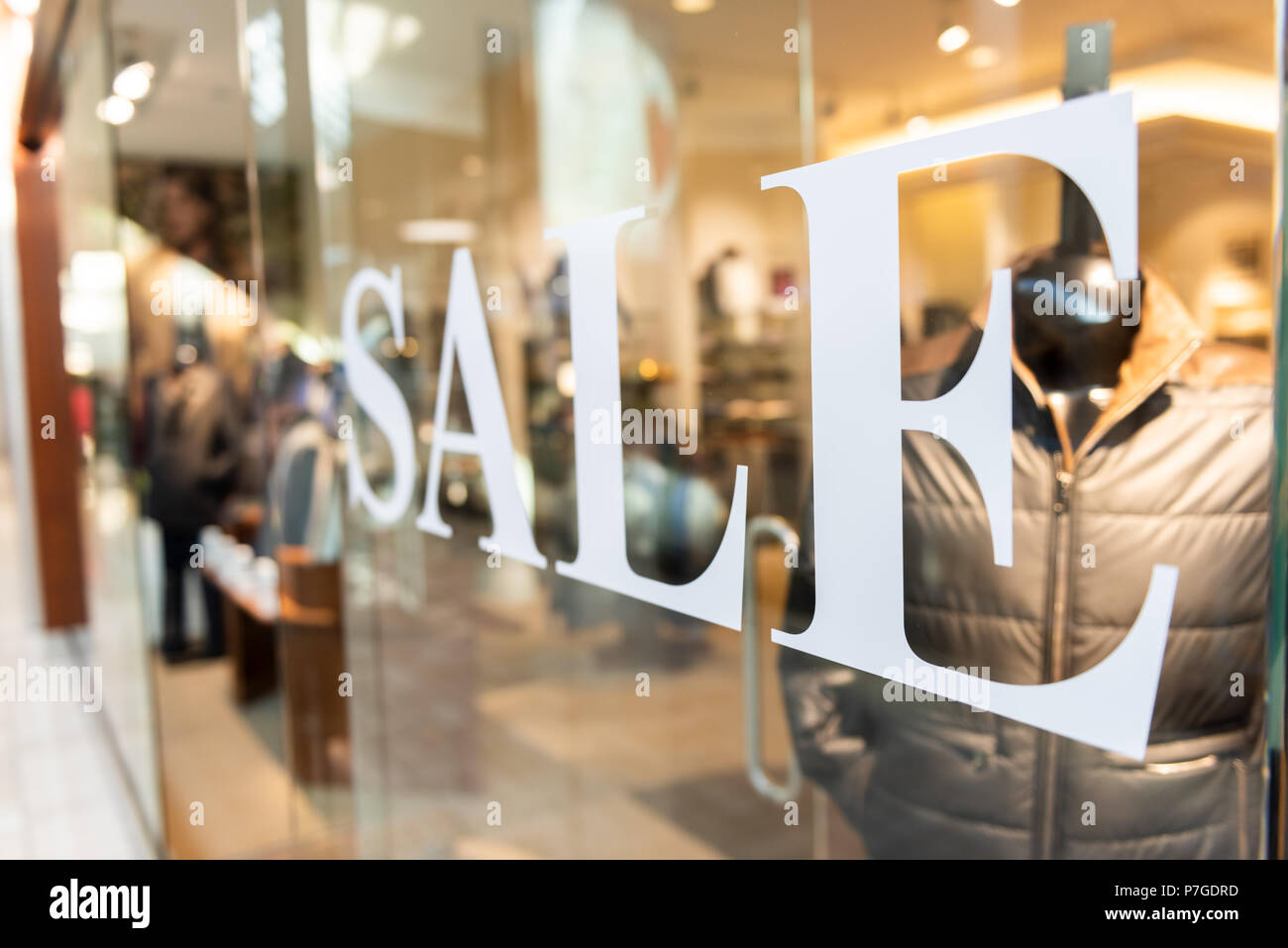 Closeup of Sale sign on clothes, clothing, apparel retail store, shop ...