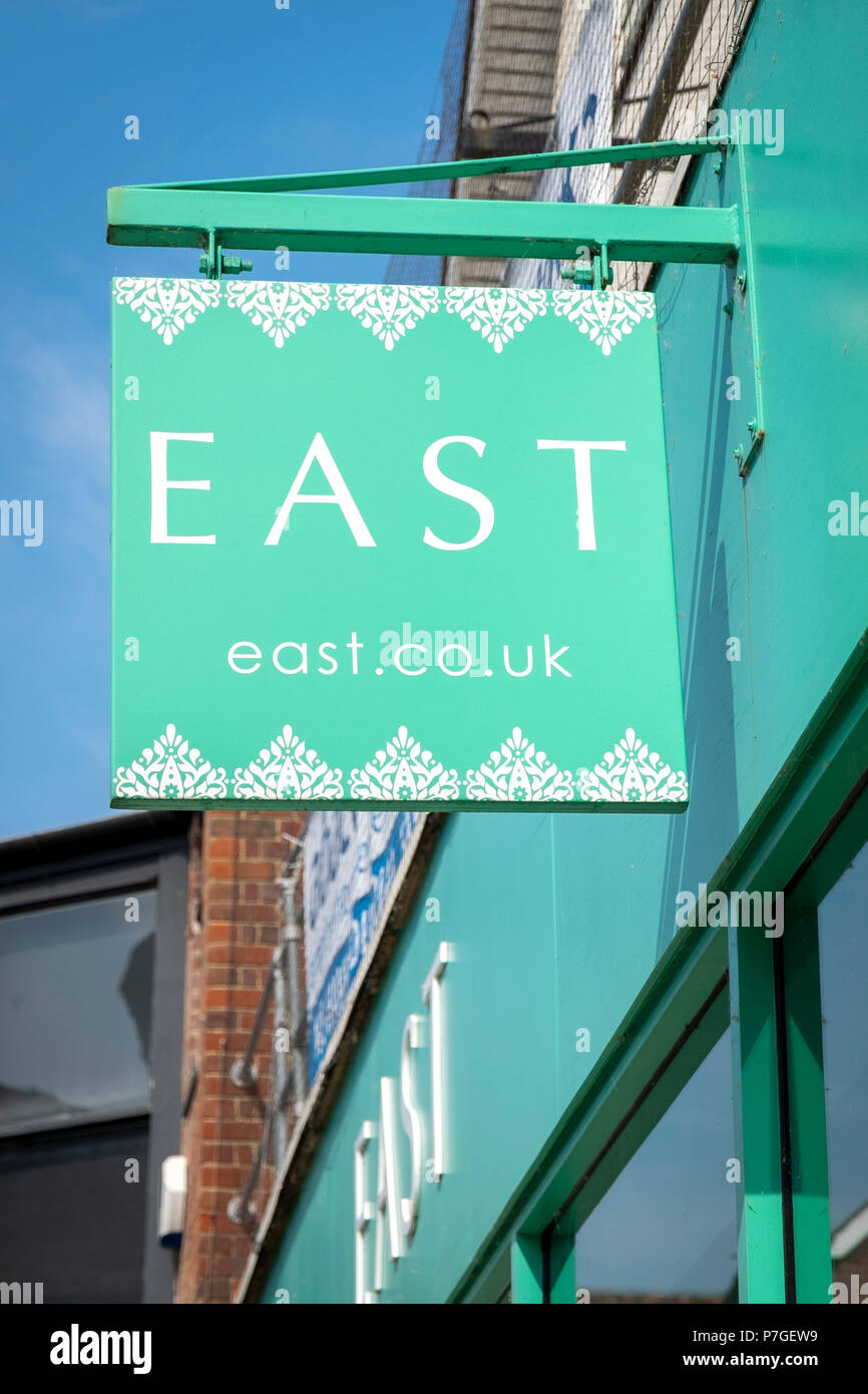 East clothing store sign Stock Photo - Alamy