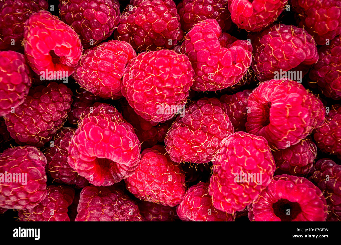 Raw fresh raspberry, close top view, fruit background Stock Photo - Alamy