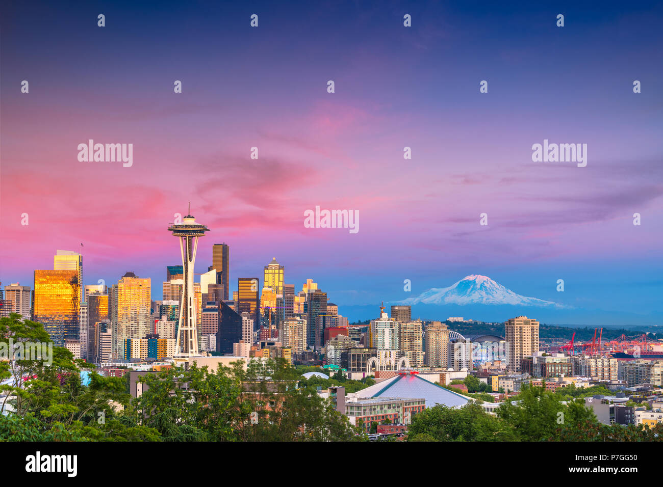 Seattle, Washington, USA downtown skyline at night with Mt. Rainier ...