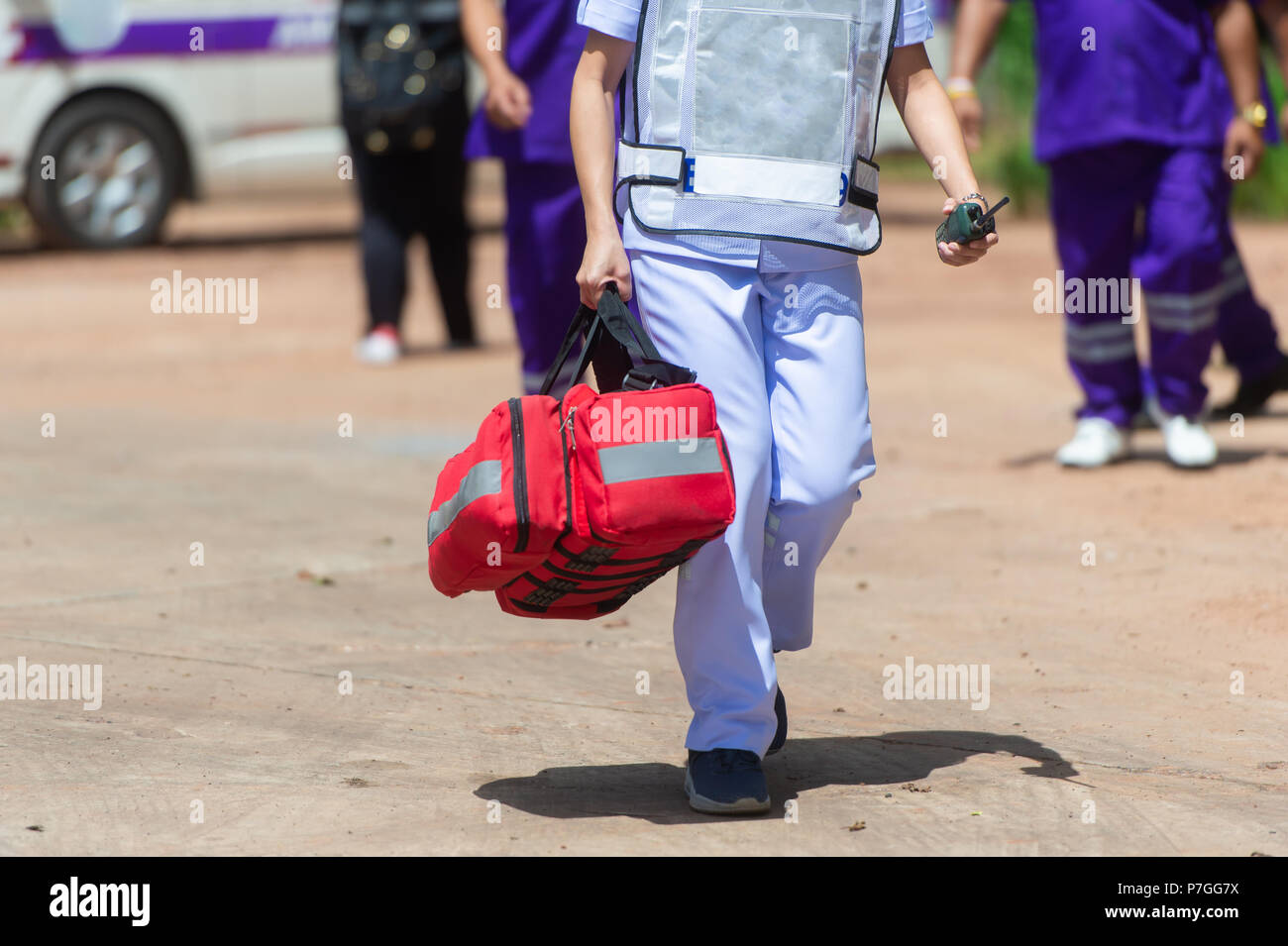 Staff of medic carry medic bag Stock Photo - Alamy