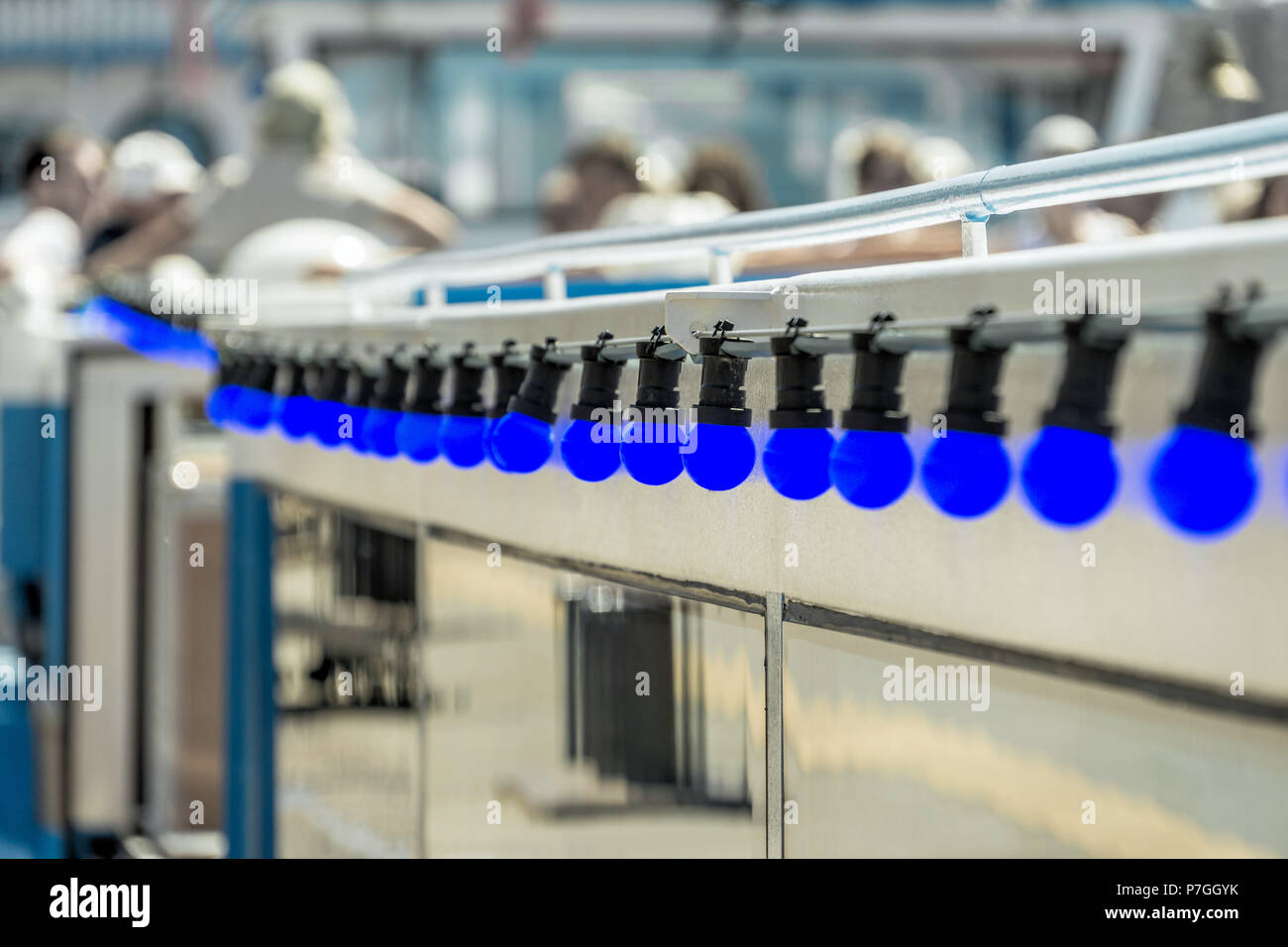 Abstract picture of a string of lights on an excursion ship in the port ...