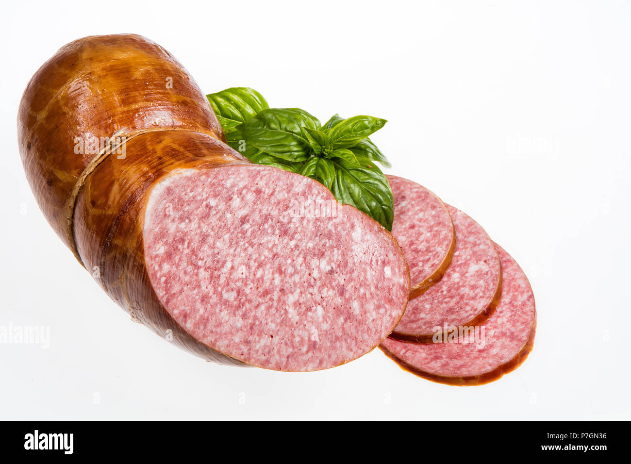 Sausge with greenery on an isolated studio background Stock Photo - Alamy