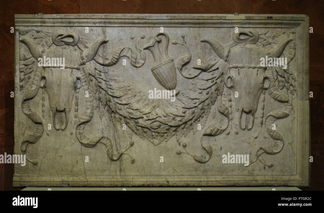 Roman art. Decorative slab. Sacrifical bull's skulls, vase and garlands ...