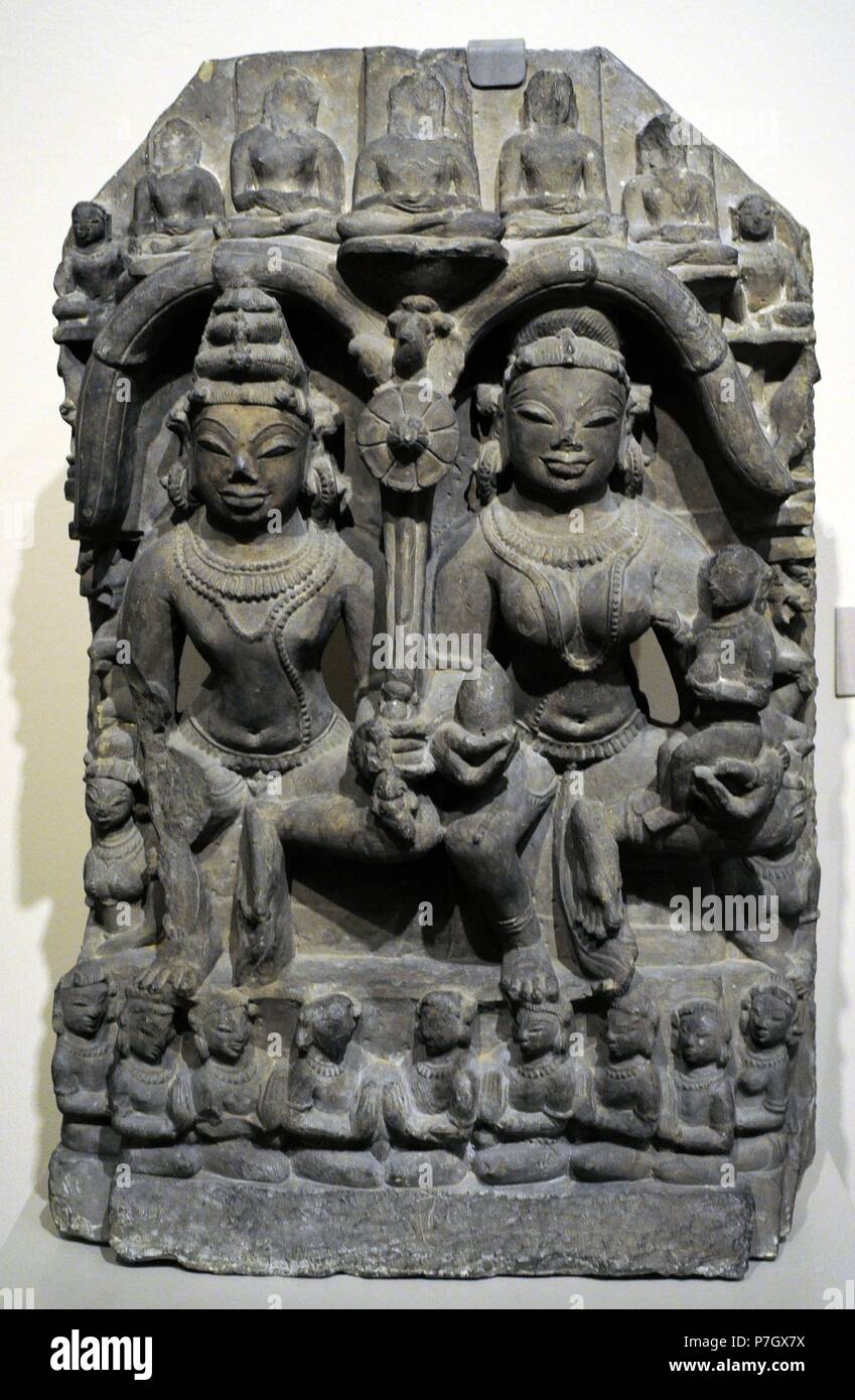 Hinduism. Sitting Jain yaksha and yakshini. Pyllite. Late Pala, 12th ...