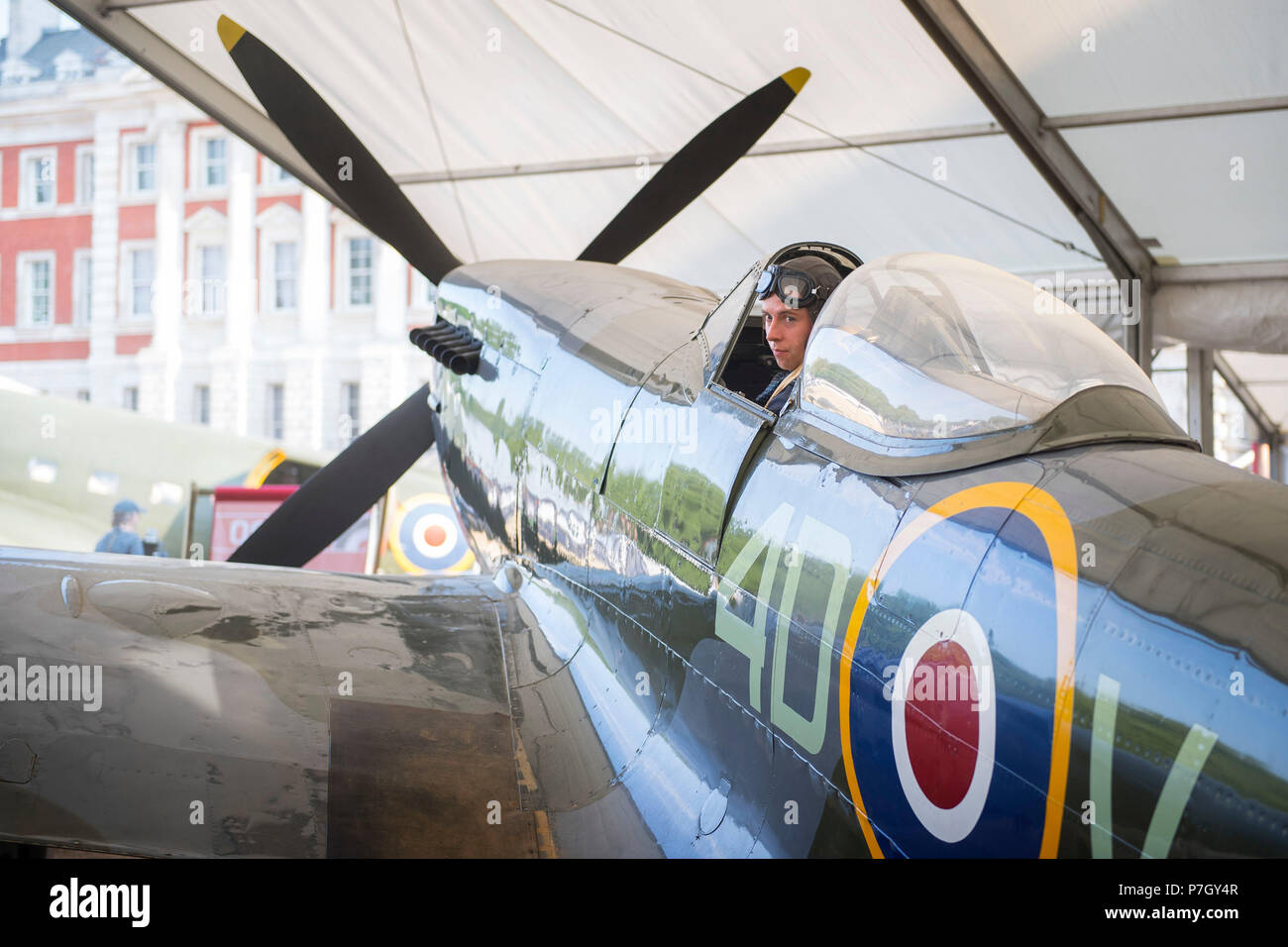 A reenactor sits in a Supermarine Spitfire Mk16-A on show at Horse ...