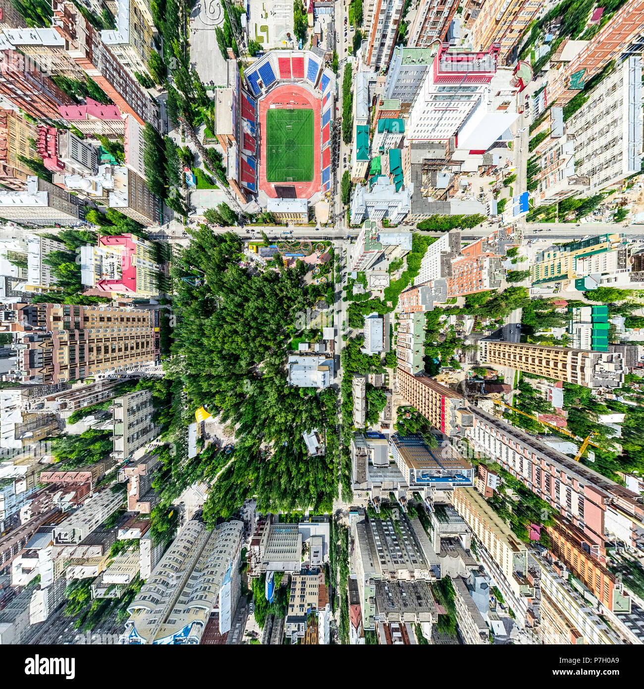 Aerial city view with crossroads and roads, houses, buildings, parks ...